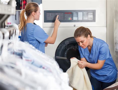 Two Happy Workers Of Laundry During Daily Work Stock Image Image Of