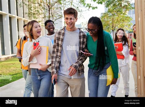 Cheerful Group Of Multi Ethnic Students Walking Towards The Camera