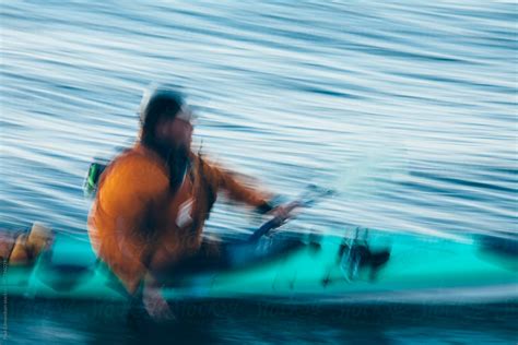 Man Sea Kayaking In Puget Sound Blurred Motion By Stocksy