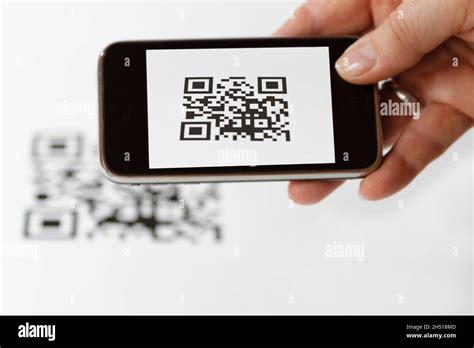 A Cellphone In Hand While Scanning A QR Code Stock Photo Alamy