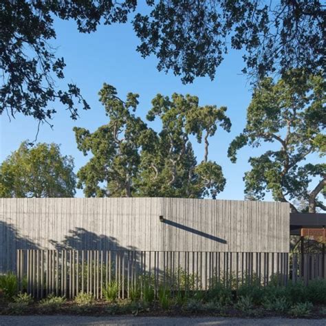 Tall Acoustic Wall Buffers Noise At Modal Home In Silicon Valley