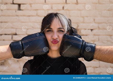 Young And Beautiful Girl With A Punky Tendency She Is Being Hit On Each Side Of Her Face With