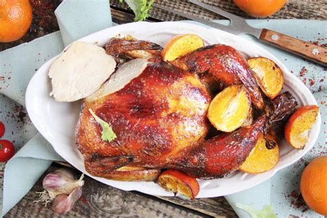 Курица целиком с мандаринами в духовке 8 фото в рецепте