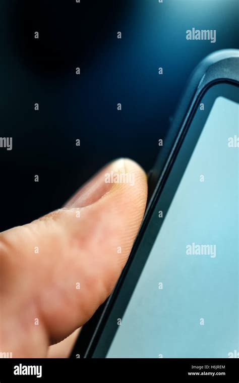 Unlocking Smart Phone With Fingerprint Sensor Scan Close Up With Selective Focus Stock Photo