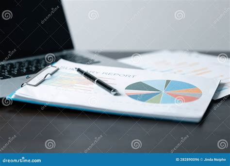 Business Data Analysis On Laptop Financial Charts Graphs Reports For