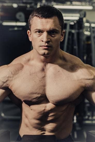 Topless Man In Black Shorts Holding White Surfboard Photos By Canva