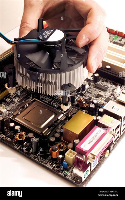 CPU Processor Fan Cooling Chip On A Motherboard Mainboard Stock Photo Alamy