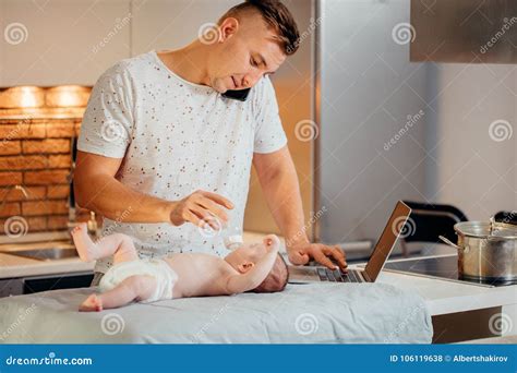 Man Working From Home And Taking Care Of Baby Stock Photo Image Of Indoors Businessman