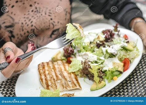 Woman Enjoying A Meal With Fork And Knife Stock Image Image Of Dinner Meal 313795533