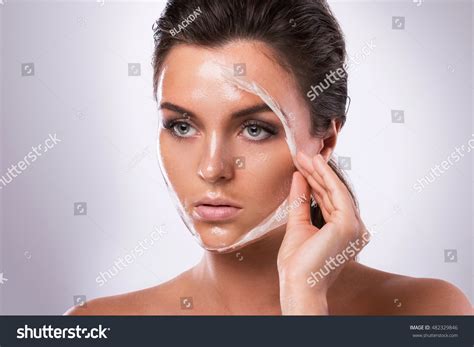 1758 Young Beautiful Woman Purifying Mask On Her Face Images Stock
