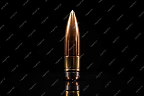 Premium Ai Image Close Up View Of Isolated Bullet With Reflection On
