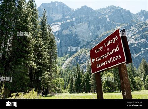 A Signpost In Yosemite National Park Pointing Towards Curry Village