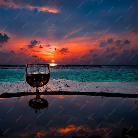Premium Photo Maldives Luxurious Beach With Goats And Glasses Of Wine