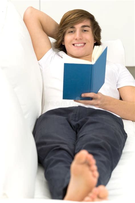 Man Lying On Sofa Reading Stock Image Image Of Person