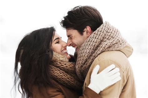 Sweet Couple Rubbing Their Noses Hugging Standing In Snowy Forest Stock Image Image Of Holding