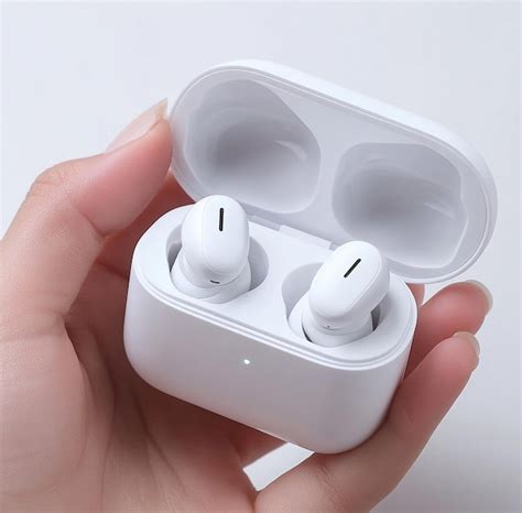 A Person Is Holding An Apple Device In Their Hand Premium Ai