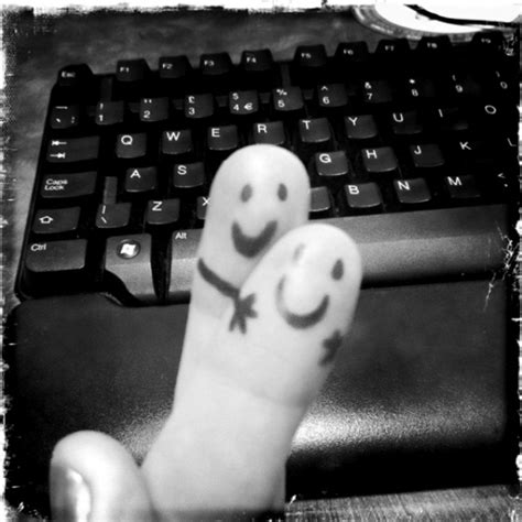 Smiley Faces On Fingers Typing On A Keyboard
