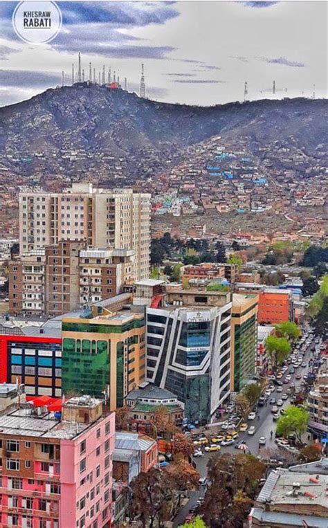The City Is Full Of Tall Buildings And Mountains