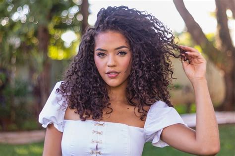 Premium Photo Beautiful Afro Woman With Curly Hair Smiling