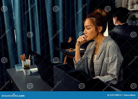 Businesswoman Focusing Computer With Coworker Working At Back Side Infobahn Stock Image