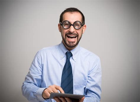 Premium Photo Happy Nerd Using His Tablet