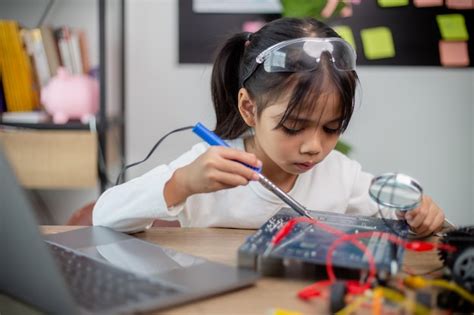 Premium Photo Asia Students Learn At Home In Coding Robot Cars And