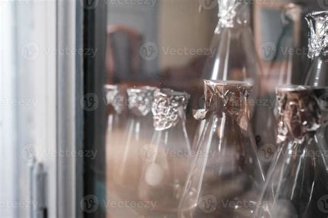 Empty Erlenmeyer Flask In A Cupboard On A Shelf Conical Flask With Foil Instead Of A Lid In A
