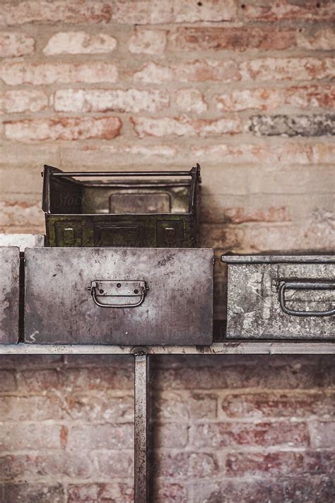 Old Rusty Containers Against Of Brick Grunge Wall By Stocksy Contributor Vera Lair Stocksy