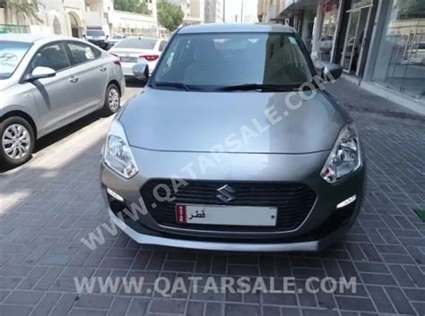 Suzuki Swift Grey Hatchback For Rent In Qatar