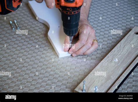 Diy Moment Detail Indoors Person Following The Steps To Build A Mdf Wooden Structure Close Up