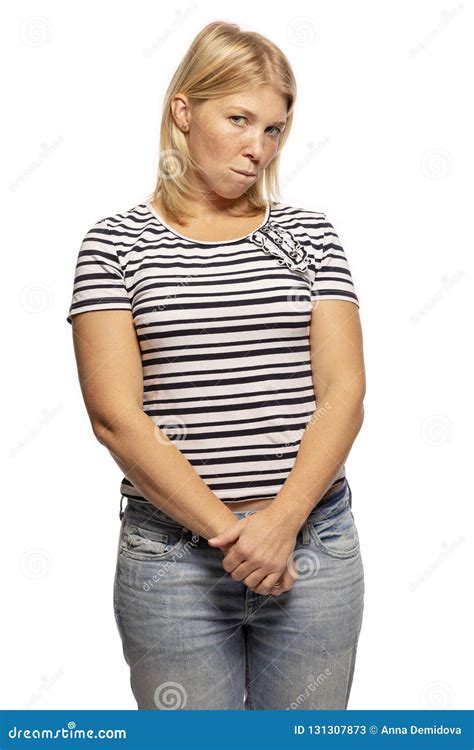 Young Woman In Shy Pose Isolated On White Background Stock Image