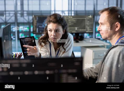 team of data center programmers brainstorming ways of ensuring minimal