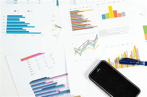 Blue Graphs And Charts With Graduation Caps Featured Photo Background And Picture For Free