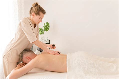 Side View Masseuse Working Free Photo