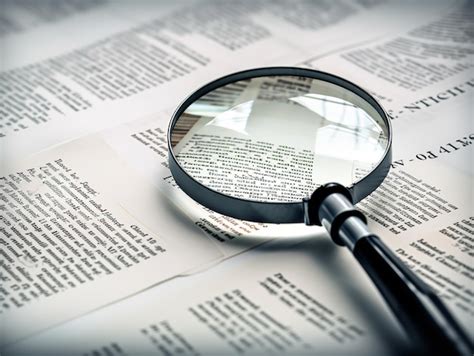 Premium Ai Image Magnifying Glass Over Book Research And Insight