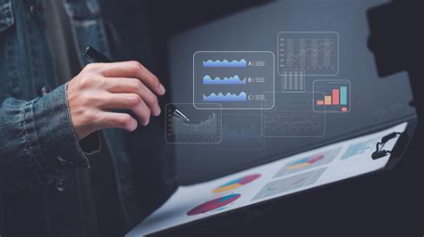 Businessman Reading Graph Report And Business Statistics Charts