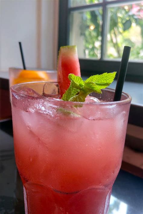 A Glass Of Chilling Cocktail On The Table On A Hot Day Stock Image