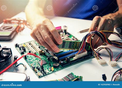 Computer Assembly Technician Install Ram Memory Module On Motherboard Stock Photo Image Of