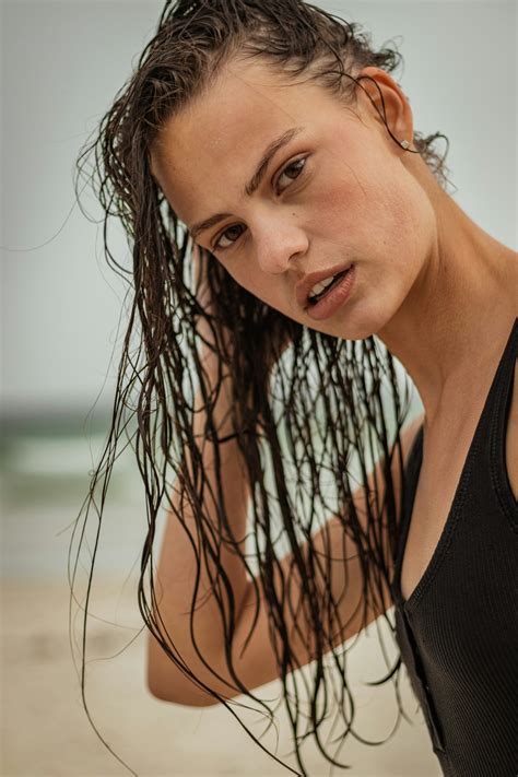 A Woman With Wet Hair On The Beach Photo Free Abstract Image On Unsplash