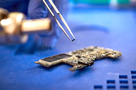 Smartphone Repair Tweezers With Microchip At Mobile Phone Repairing Stock Photo Image Of