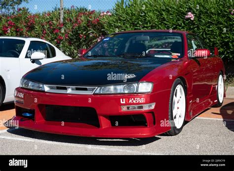 A Red Classic Japanese Nissan Silvia S14 Kouki Sports Car Parked On The
