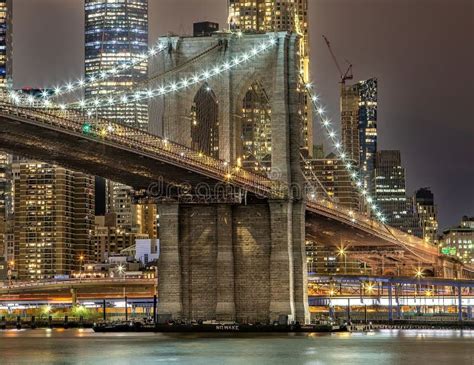 Brooklyn Bridge Illuminated With Lights At Night On The Background Of