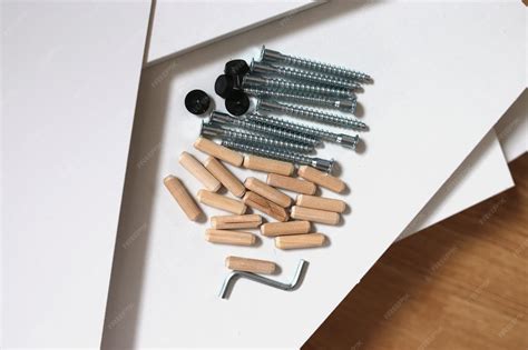 Premium Photo Details For Assembling Furniture Closeup On The Details Of Cabinet Furniture