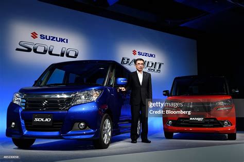 Toshihiro Suzuki President Of Suzuki Motor Corp Poses Next To The