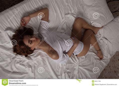 Beautiful Smiling Brunette Woman With Long Slim Legs Posing Bedroom