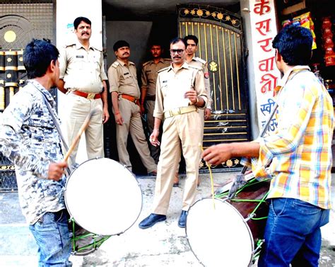 Police Conducts Munadi Outside The Residence Of Ashraf Over Mlas Murder