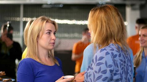 Three Girls Are Having Fun Communicating At A Party In The Office