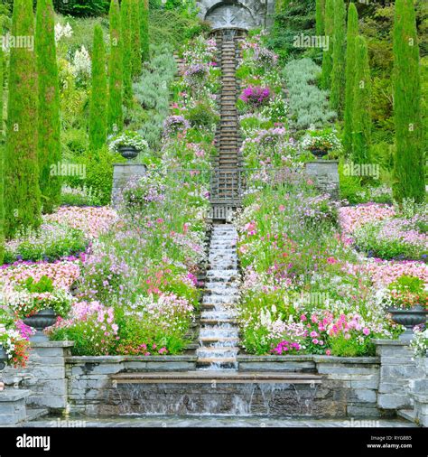 Flower Garden And Other Plants A Staircase And A Waterfall On The