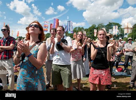 Crowds Of Festival Goers Applauding And Looking At The Stage At The