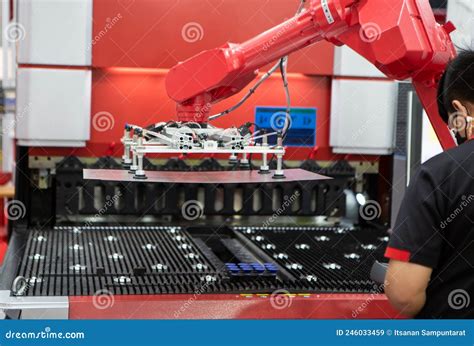 Robot Arm Loading Metal Sheet To Laser Cutting Machine Stock Image
